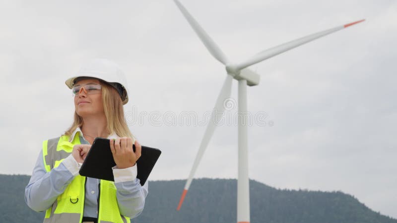 A Female Engineer with a Digital Tablet Checks the Technical Parameters ...