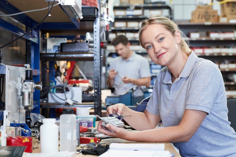 Portrait of Female Engineer in Factory Measuring Component at Work ...