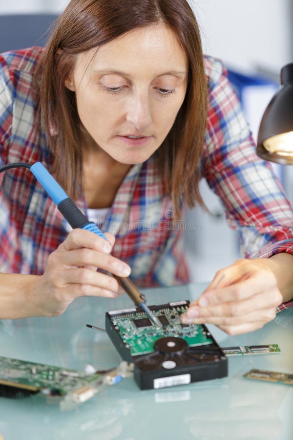 Female Engineer Fixing Broken Computer Hard Drive Stock Image - Image ...