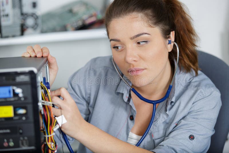 Female Engineer Listening To Computer with Stethoscope Stock Image ...