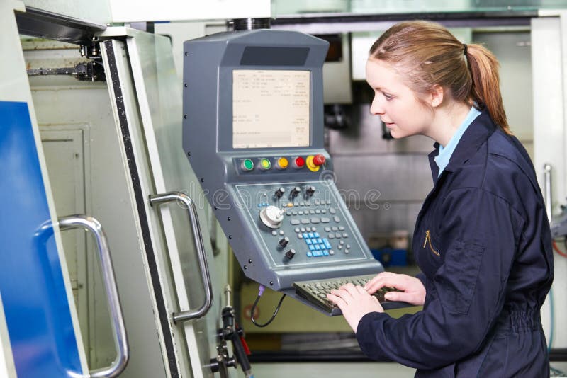 Female Engineer Operating Computerized Cutting Machine Stock Photo ...