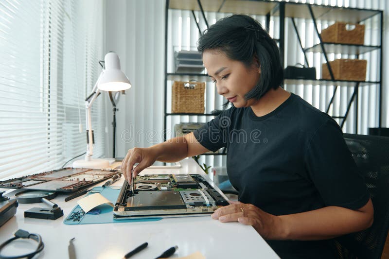 Female Engineer Repairing Computer in Workshop Stock Photo - Image of disassemble, component ...