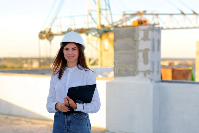 Female Engineer Showing a Document To a Construction Worker on a Rooftop Stock Photo - Image of ...
