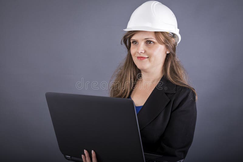Female Engineer Standing and Using Her Laptop Stock Image - Image of ...
