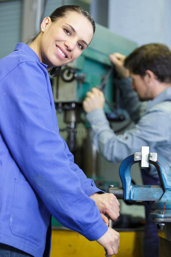 Female Engineer Tightening Vice Stock Image - Image of blue, occupation ...