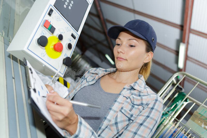 Female Engineer Using Computerized Cutting Machine Stock Image - Image ...