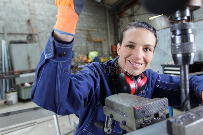 Female Engineer Using Drill in Factory Stock Image - Image of women ...