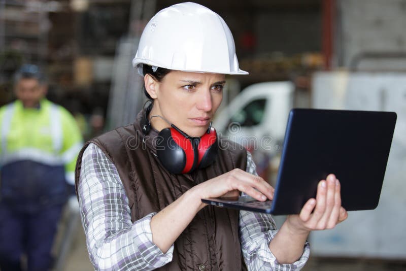 Female Engineer Using Programming Software on Laptop Stock Photo ...