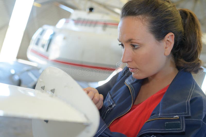 Female Engineer Working on Aircraft Component Stock Photo - Image of ...