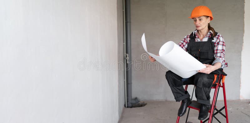 Female Engineer Working at Construction Site with Project Blueprint ...