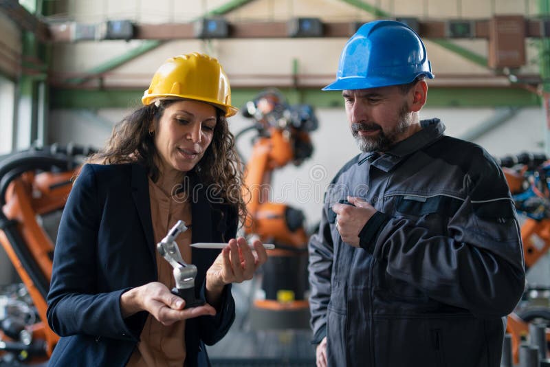 Female Engineering Manager and Mechanic Worker Doing Routine Check Up ...