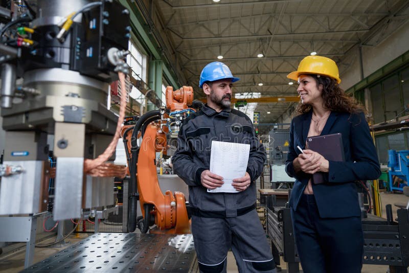 Female Engineering Manager and Mechanic Worker Doing Routine Check Up ...