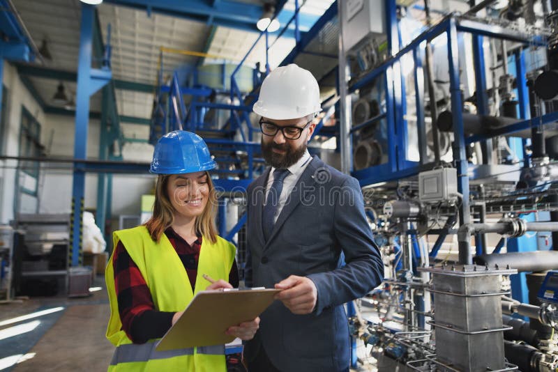 Engineering Manager and Mechanic Worker Doing Routine Check Up in ...