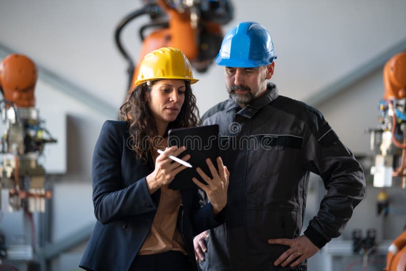 Female Engineering Manager and Mechanic Worker Doing Routine Check Up ...