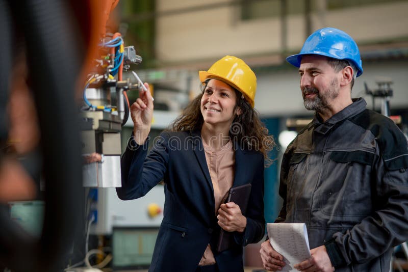 Female Engineering Manager and Mechanic Worker Doing Routine Check Up ...