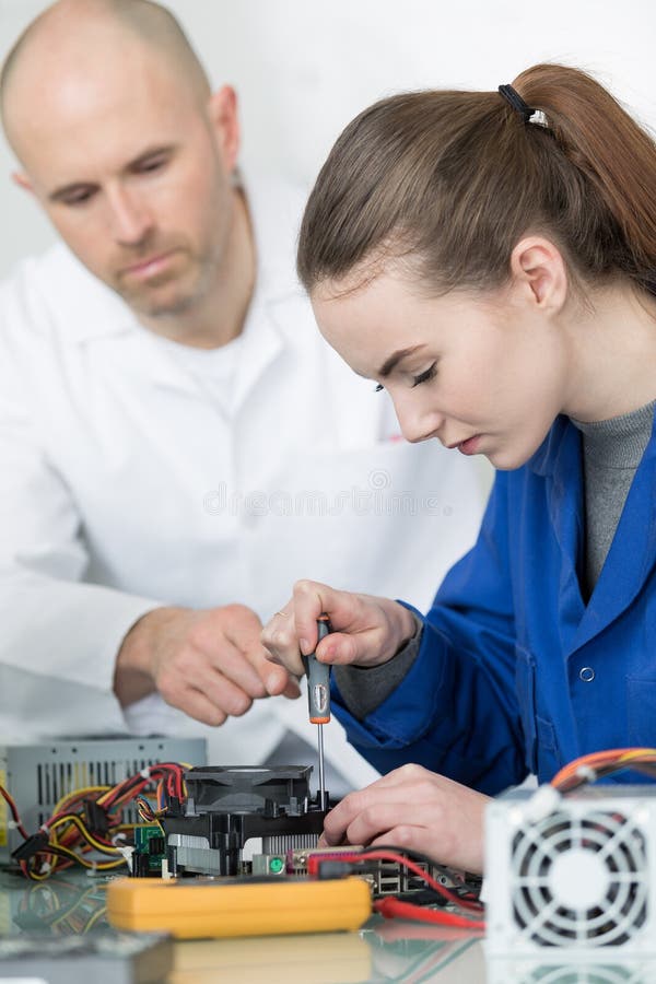 Female Engineering Student Making Connections for Electronics ...
