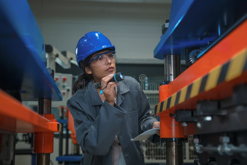 Female Engineering Technology Professional Holding a Flashlight ...