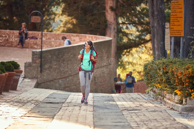Female Enjoying in Active Sightseeing in Italy, Walking with Backpack ...