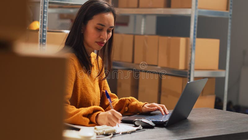 Female Entrepreneur Taking Notes on Papers and Pc Stock Photo - Image ...