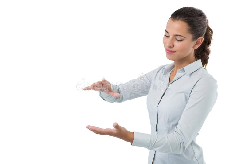 Female Executive Holding Invisible Object Stock Photo - Image of ...