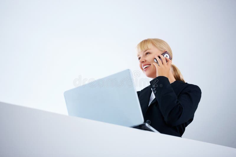 Female Executive with Laptop Talking on Cellphone. Portrait of Female ...