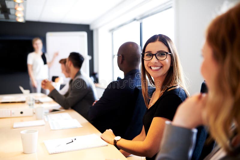Female Executive Smiling at Camera during Work Presentation Stock Photo ...