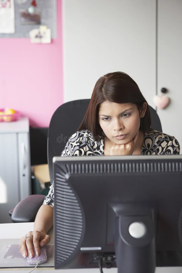 Female Executive Using Computer at Office Desk Stock Photo - Image of ...
