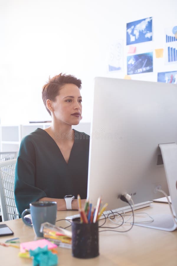 Female Executive Working on Computer at Desk Stock Image - Image of ...