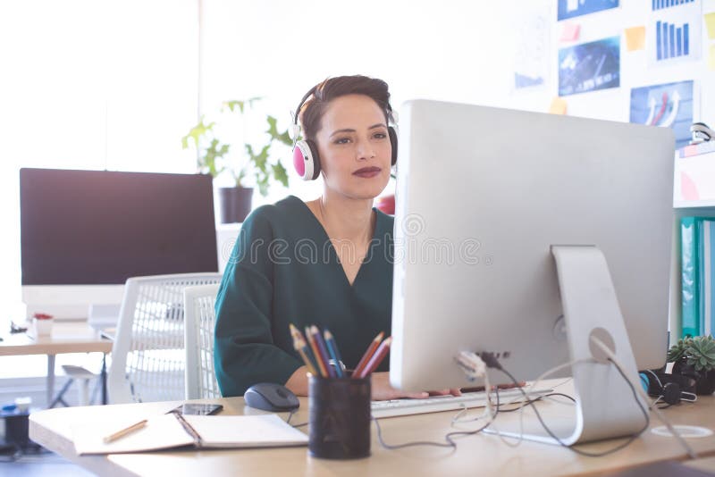 Female Executive Working on Computer at Desk Stock Image - Image of ...
