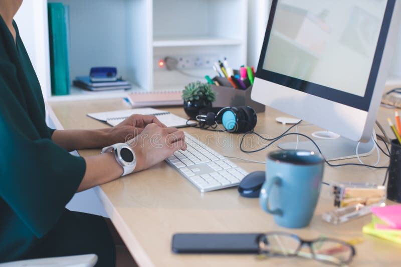 Female Executive Working on Computer at Desk in the Office Stock Photo ...