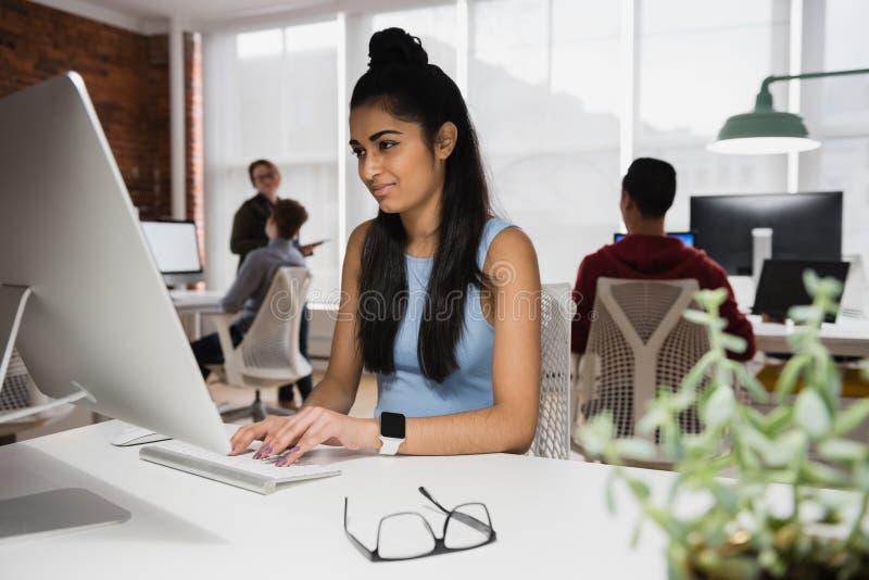Female Executive Working on Computer in Office Stock Image - Image of ...