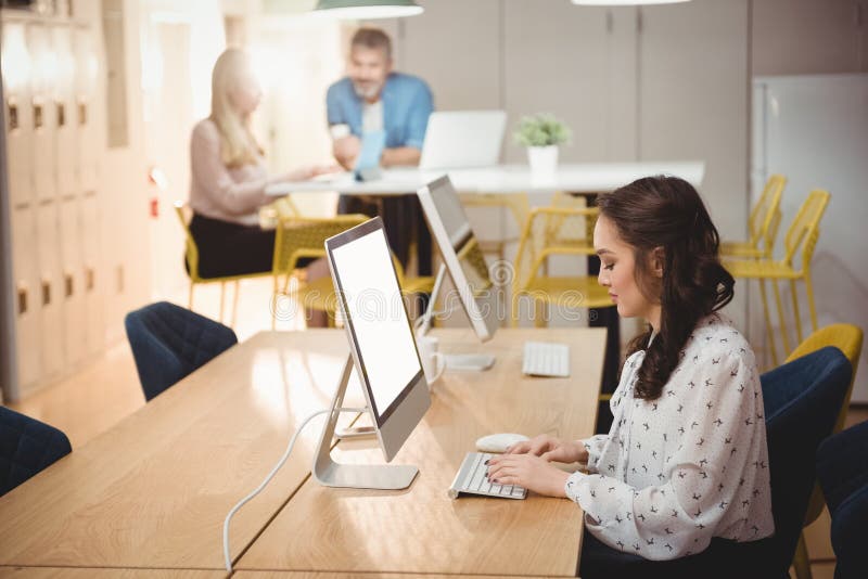 Female Executive Working on Laptop in Office Stock Photo - Image of ...