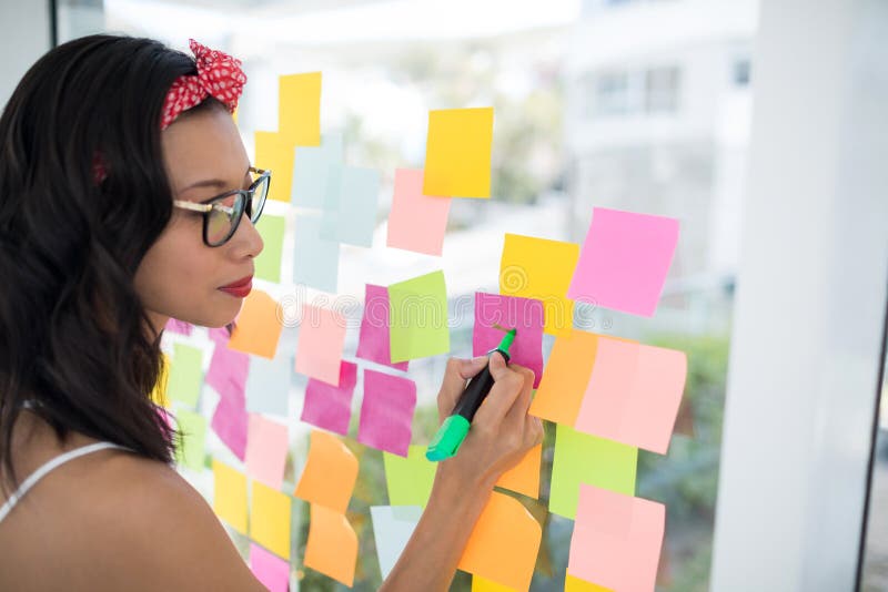 Female Executive Writing on Sticky Notes Stock Image - Image of ...