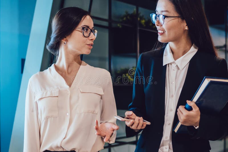 Female Executives Talking at Office Hall Stock Image - Image of ...