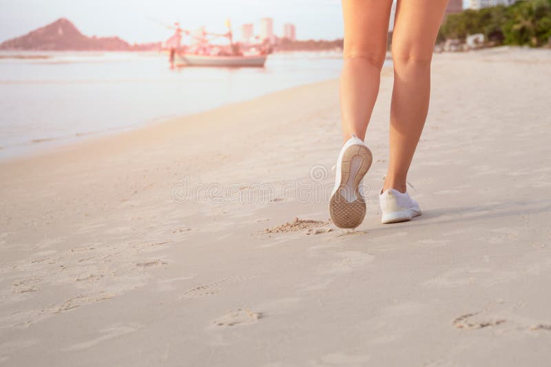 Female Exercise Walking on the Beach in the Morning. Stock Photo ...