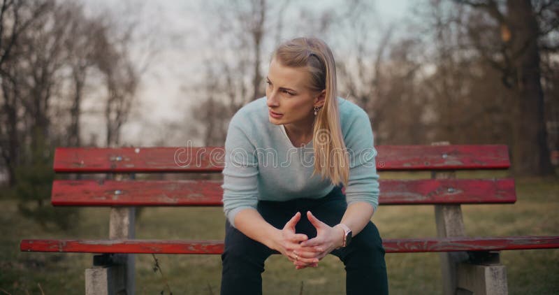 Female Explorer Checking Time Sitting on Bench Stock Video - Video of ...