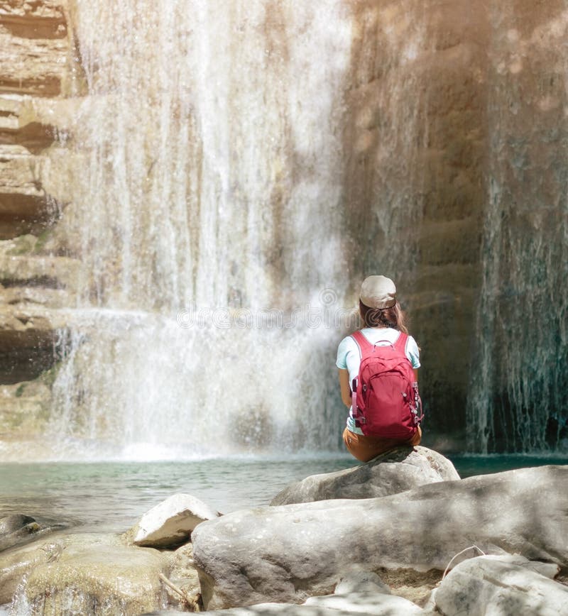 Female Explorer Enjoying View of Waterfall. Stock Image - Image of ...