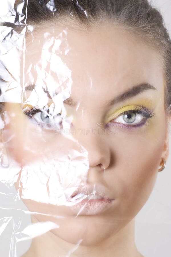 Female Face Wrapped In Cellophane Stock Photo - Image of make, sadness ...