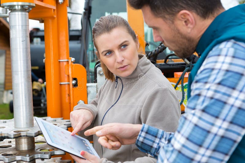 Female Factory Worker and Colleague Using Digital Tablet Stock Photo ...