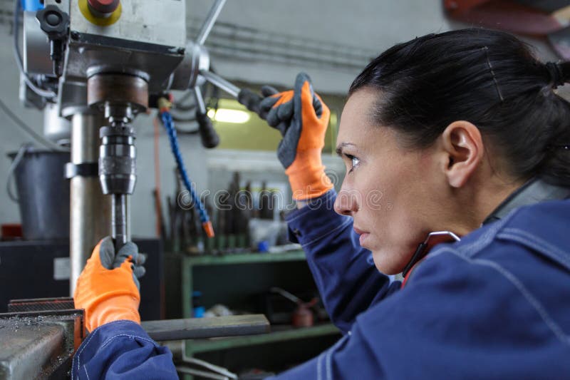 Female Factory Worker Operating Machine Stock Image - Image of ...