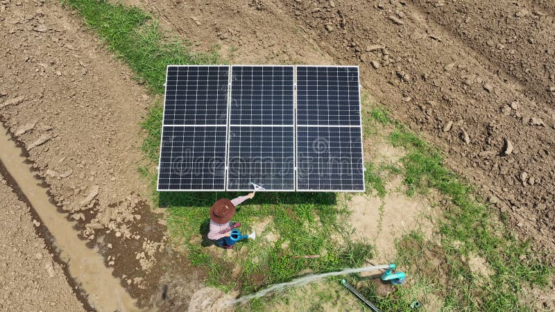 Cleaning Solar Panels.Man Washing Solar Panels from Dust and Dirt on ...
