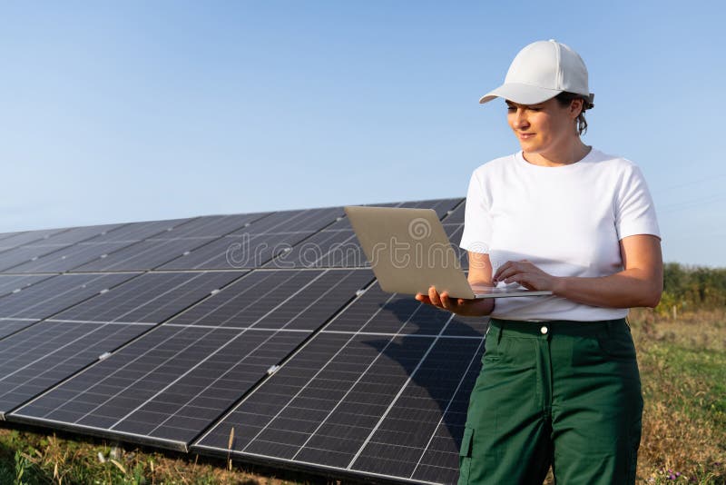 Female Farmer with Laptop on a Modern Farm Using Solar Panels Stock ...