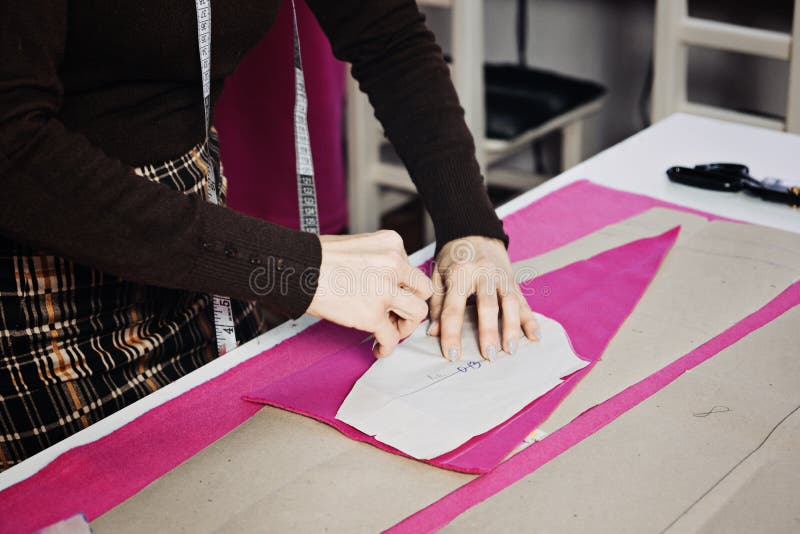 Female Fashion Designer Tailor Making Sewing Patterns at Workplace in ...
