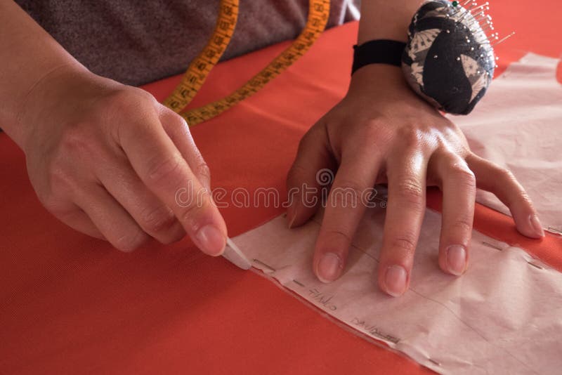 Female Fashion Designer Working with Pattern Cutting at Studio Stock ...