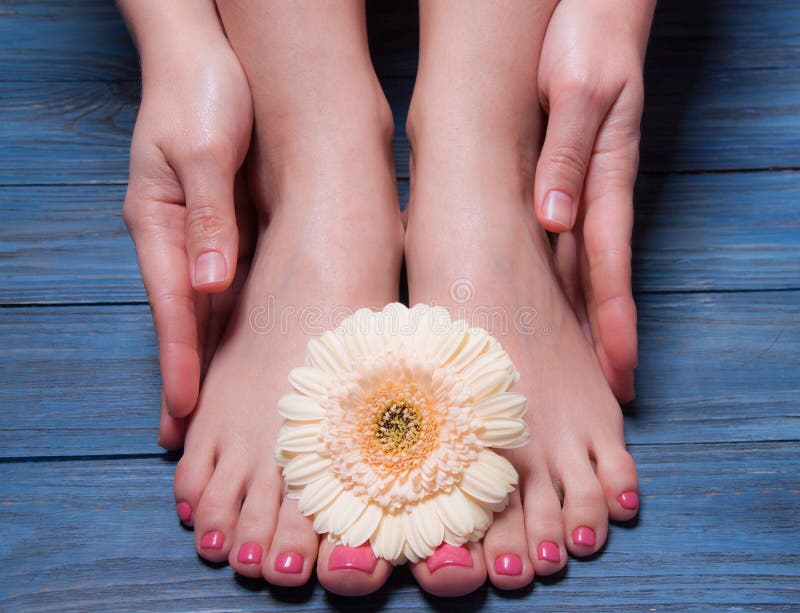 Female Feet with Flowers on Wooden Background Stock Image - Image of ...