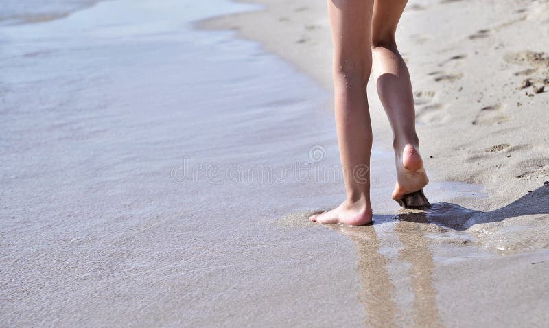 Female feet on sand stock photo. Image of footprints - 216371198