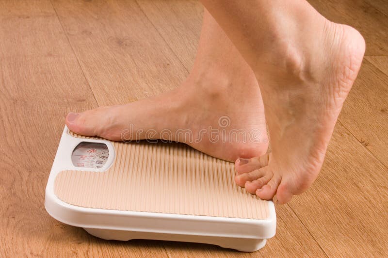 Female feet on scales stock image. Image of balance, measurement - 18081185