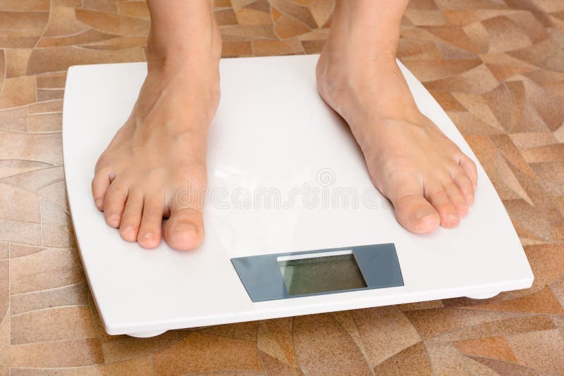 Female Feet Standing on the Scale Stock Photo - Image of balance ...