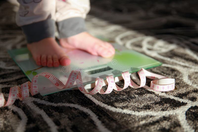 Female Feet that Step on the Floor Scale. Stock Image - Image of ...