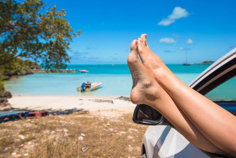 Female Feet from the Window of a Car on Background Stock Photo - Image ...